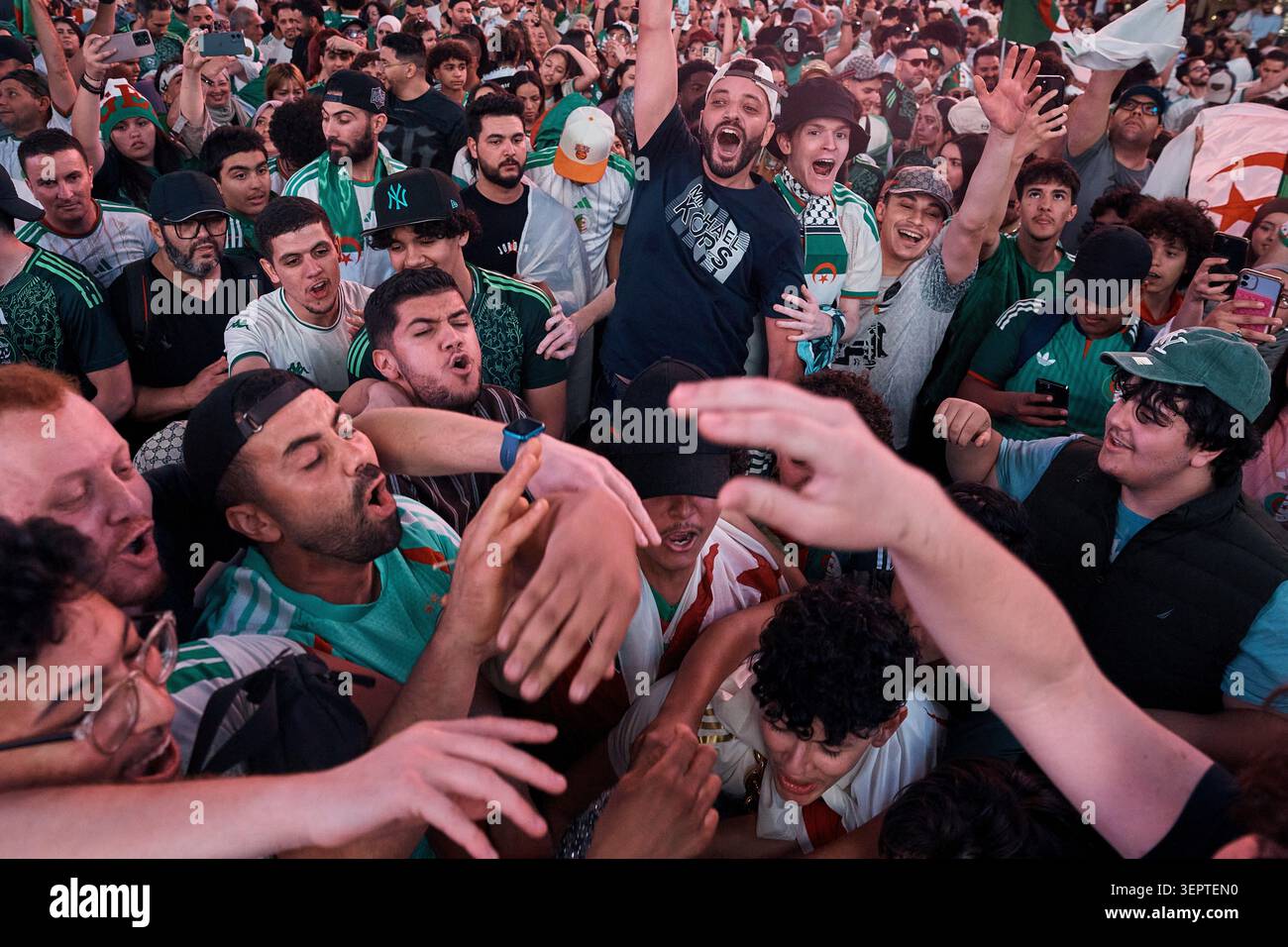 Algerian fans take part in a pre-match rally in support of the Algerian ...