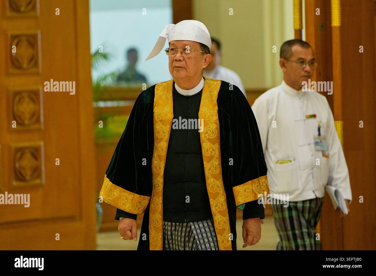 Parliament chairman Aung Lin Dwe, left, arrives to lead a regular ...