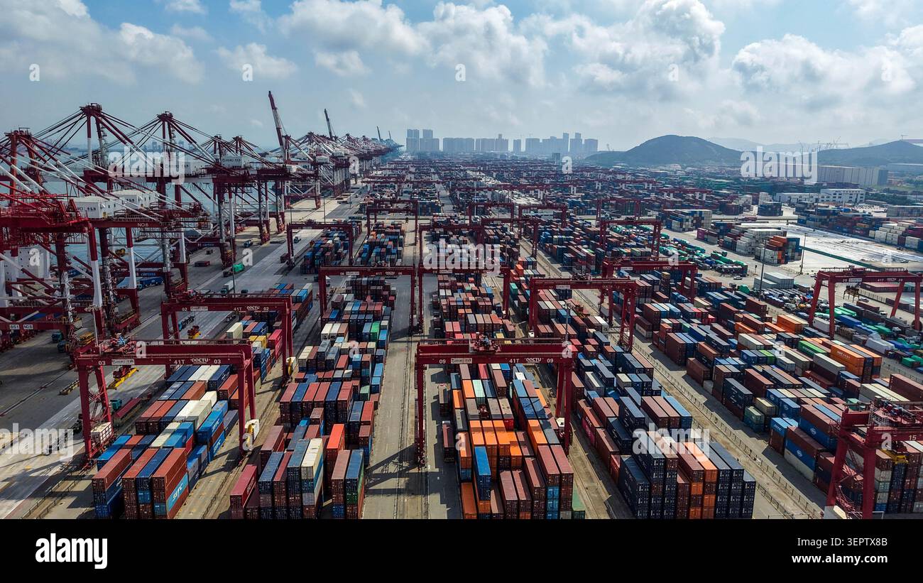 A container ship arrives at Qingdao Port in east China's Shandong ...