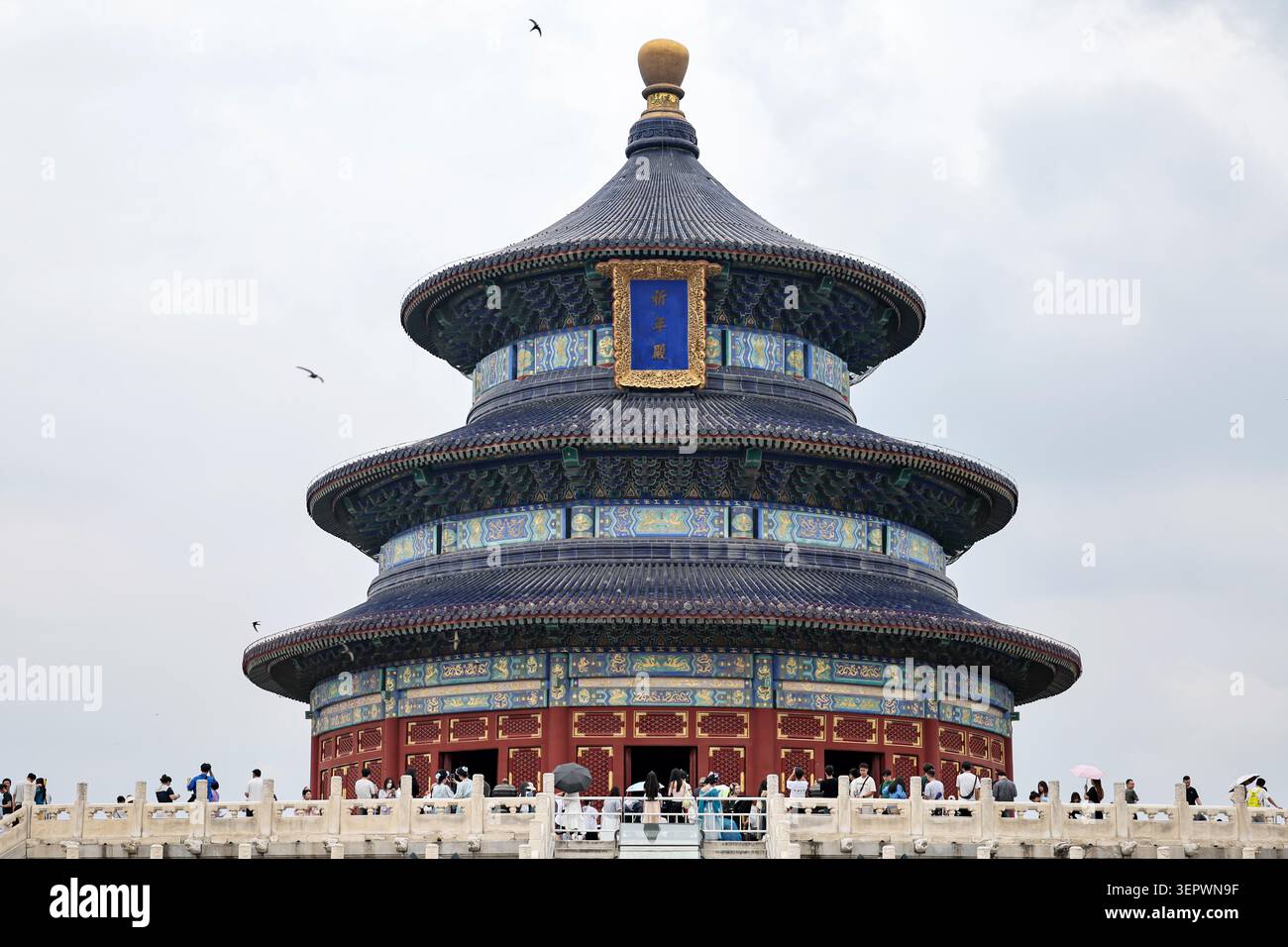 Tourists visit the Temple of Heaven Park and admire the magnificent ...