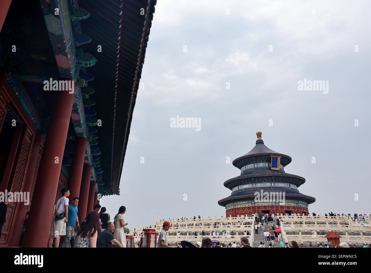 Tourists visit the Temple of Heaven Park and admire the magnificent ...