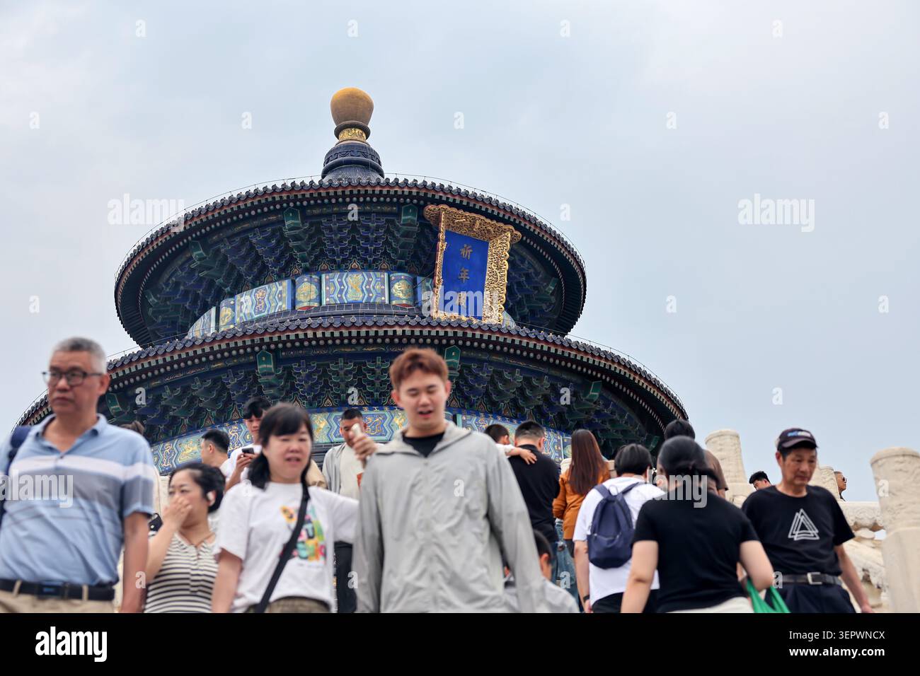 Tourists visit the Temple of Heaven Park and admire the magnificent ...