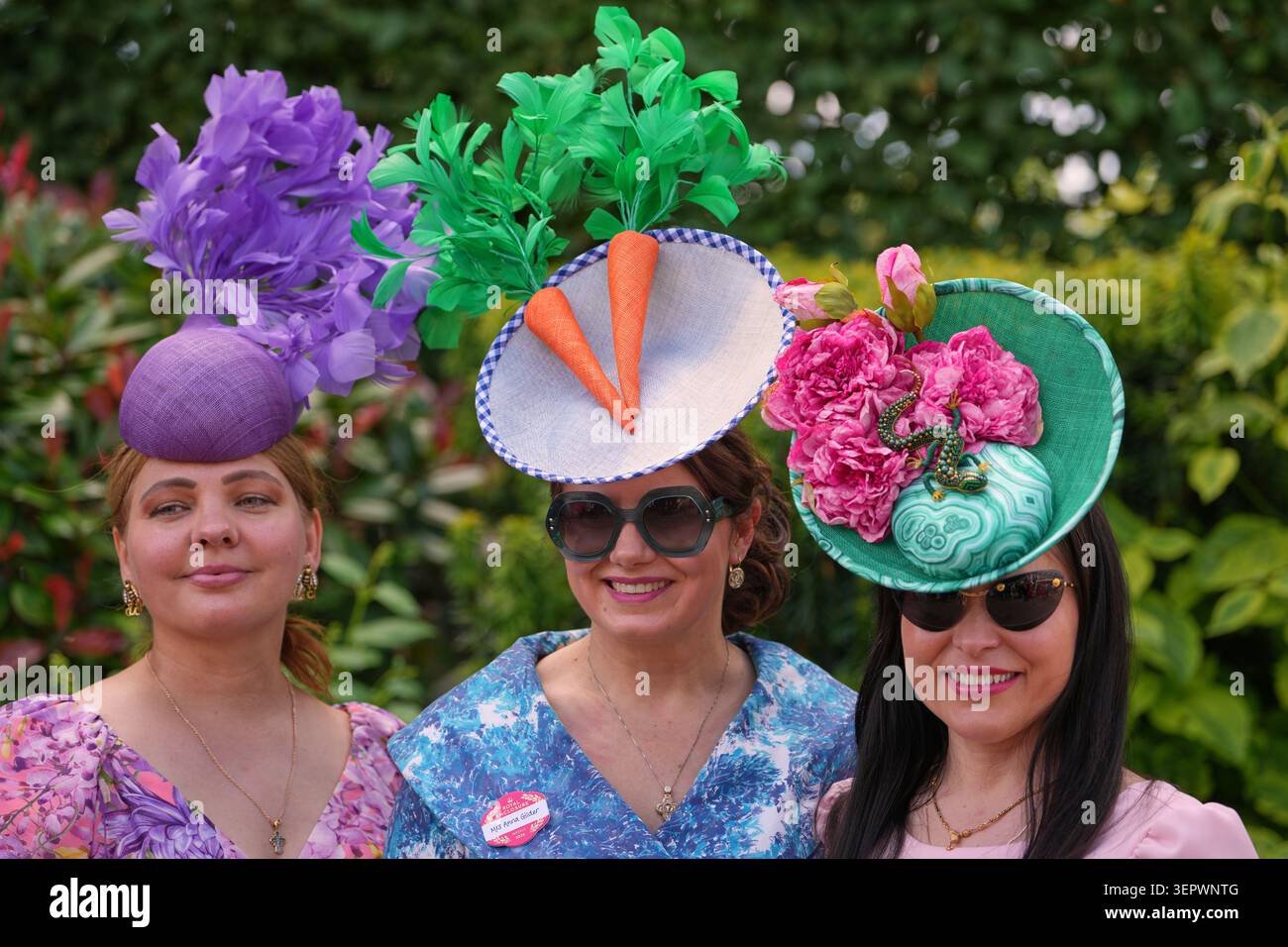Racegoers pose for picyures on the first day of the Royal Ascot horse ...