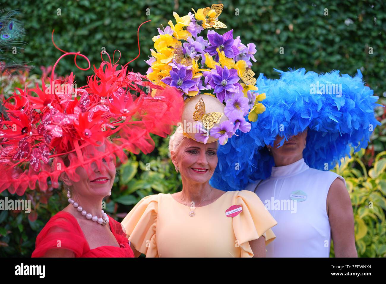 Racegoers pose for picyures on the first day of the Royal Ascot horse ...