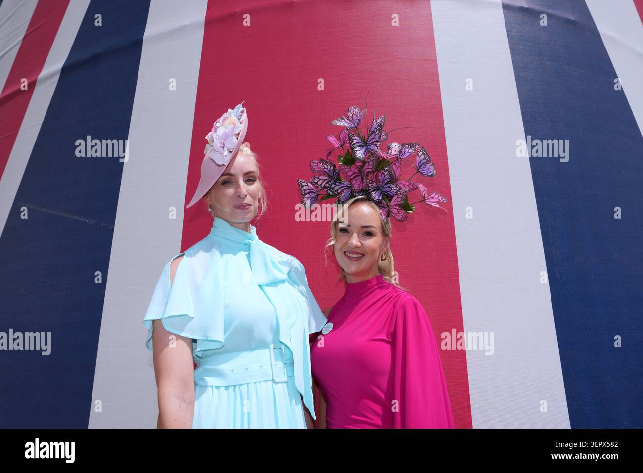 Racegoers pose for photographers on the first day of the Royal Ascot ...