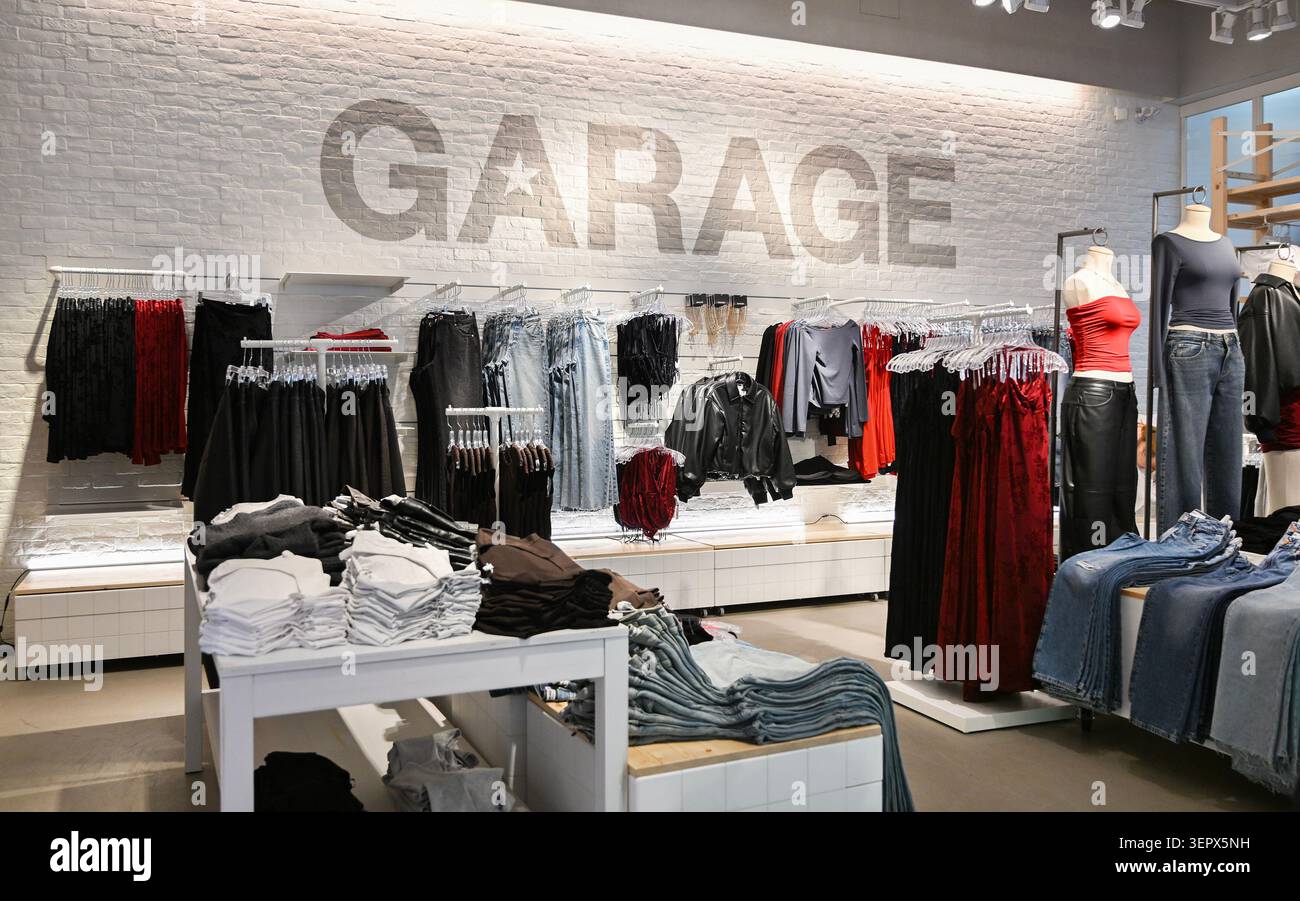 Clothing is on display inside a Garage clothing retail store in ...