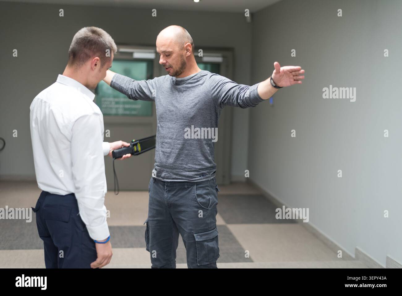 A professional security guard in a uniform conducting a safety ...