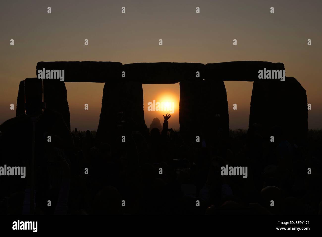 FILE - Revelers gather at the ancient stone circle Stonehenge to ...