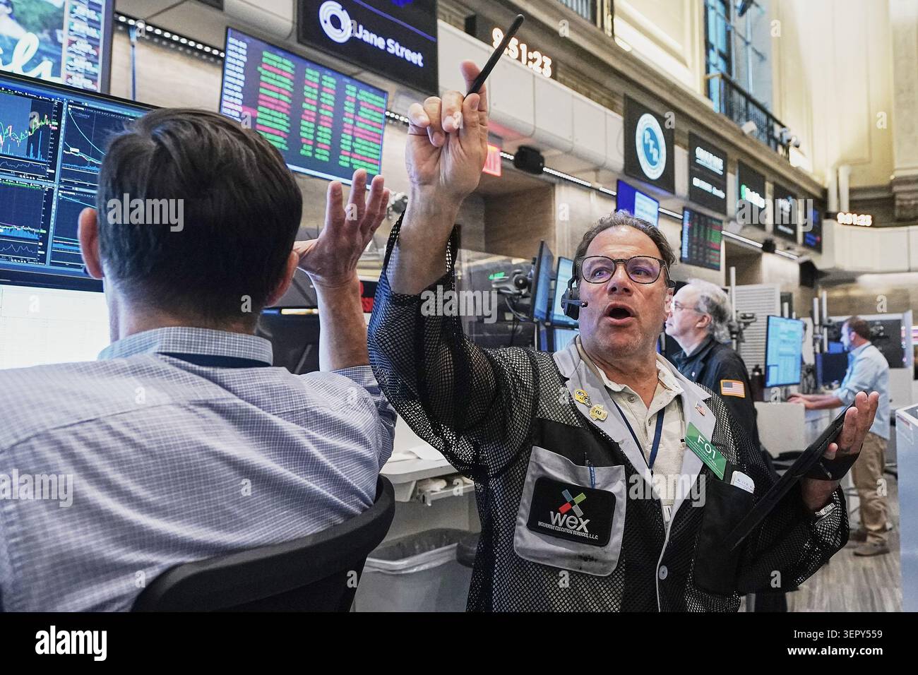 Options trader Anthony Spina, center, works on the floor of the New ...