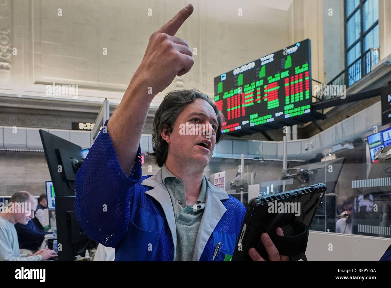Options trader Doran Swan works on the floor of the New York Stock ...