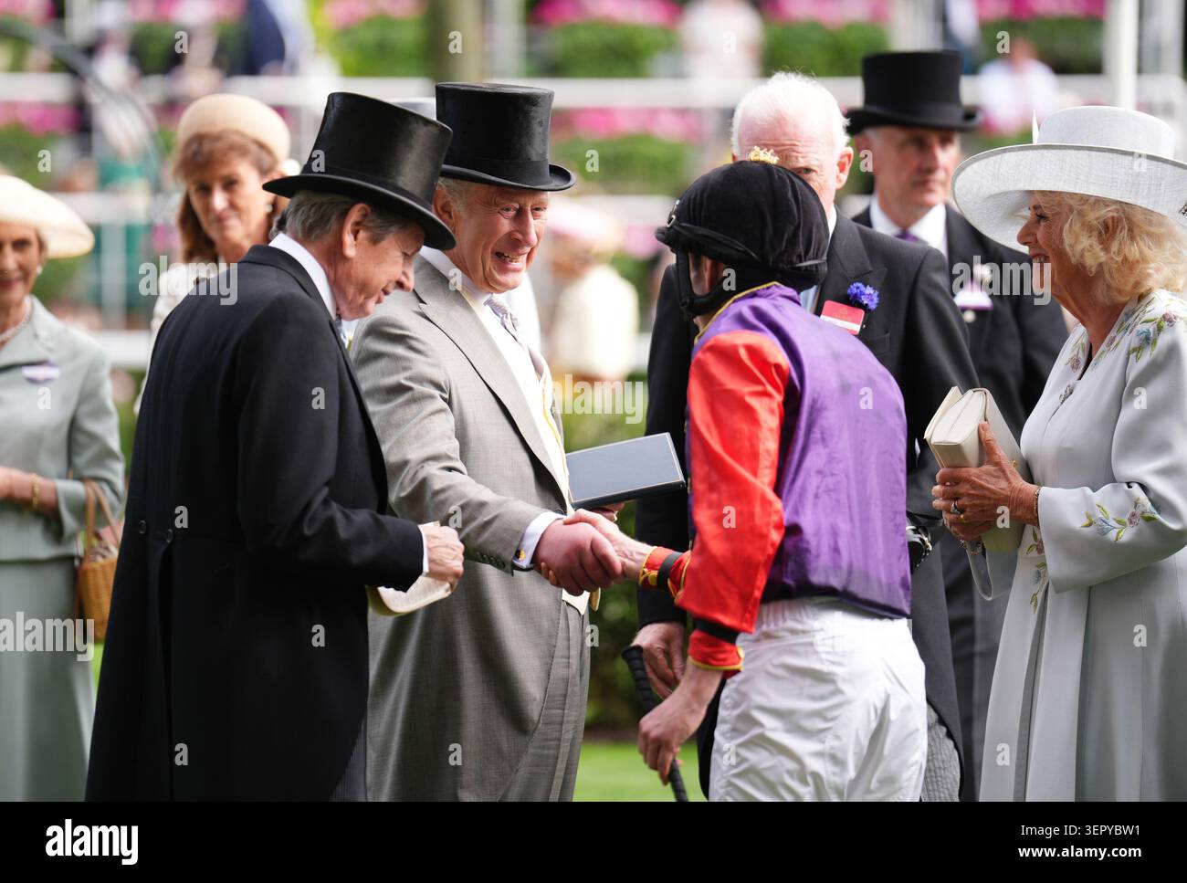 King Charles III and Queen Camilla with John Warren (left) talking to ...