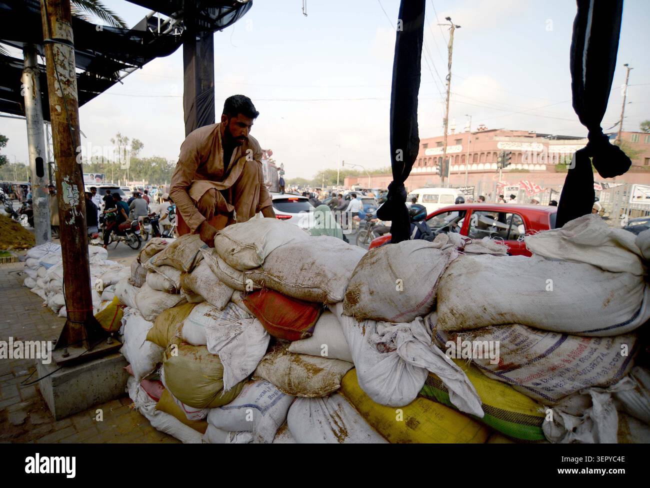 Laborers are busy in preparation of the tenth day of Muharram- ul-Haram ...