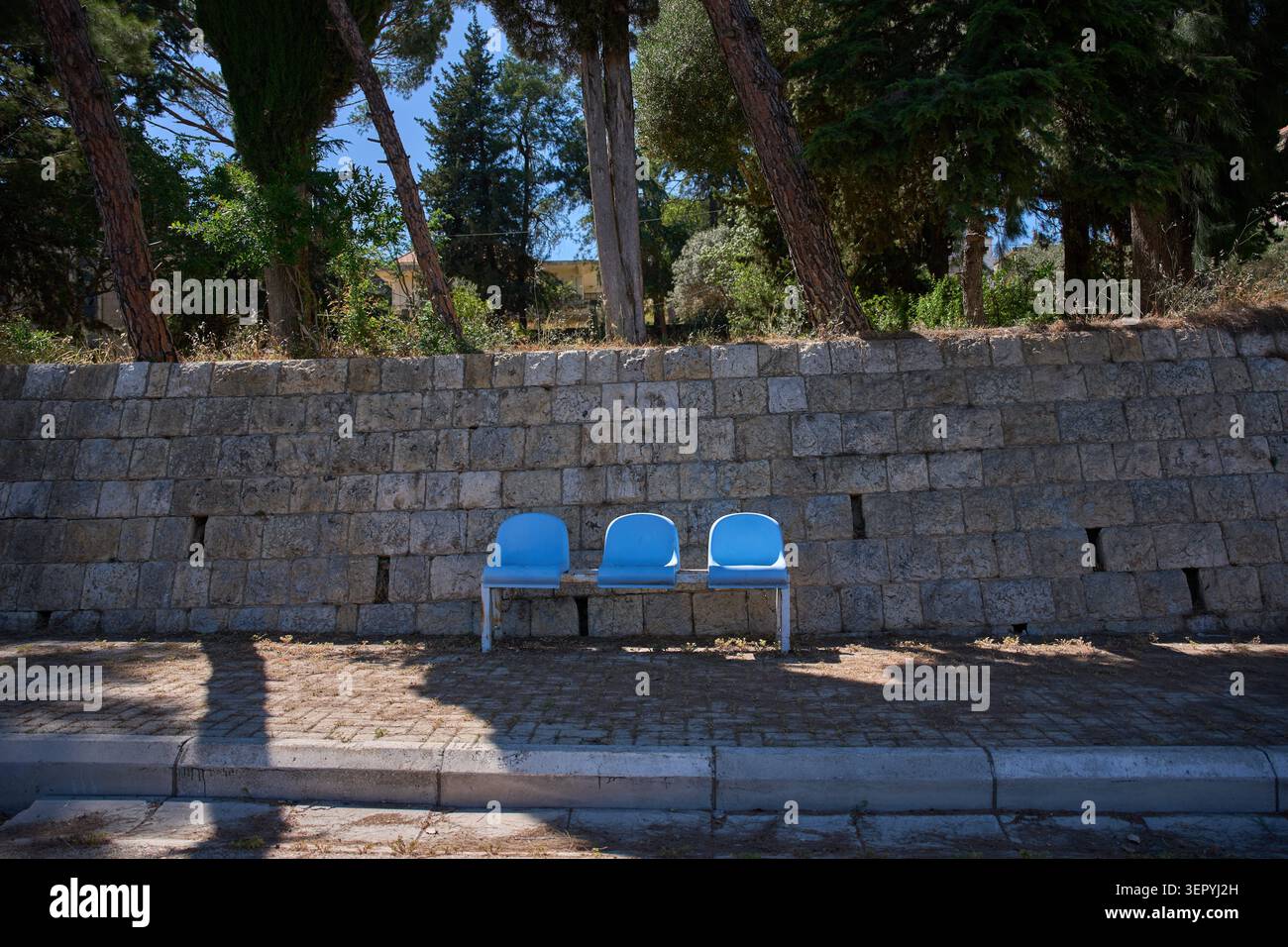 A row of empty seats is seen along a street in the southern town of ...