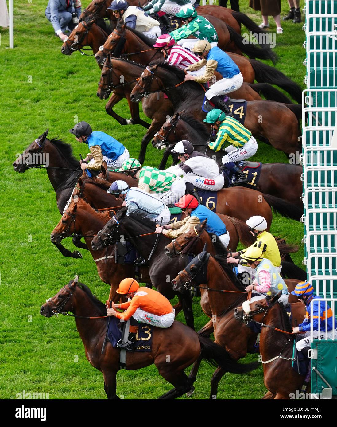 Runners and riders set off during the Copper Horse Stakes during day ...