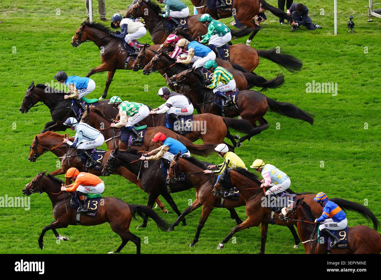 Runners and riders set off during the Copper Horse Stakes during day ...