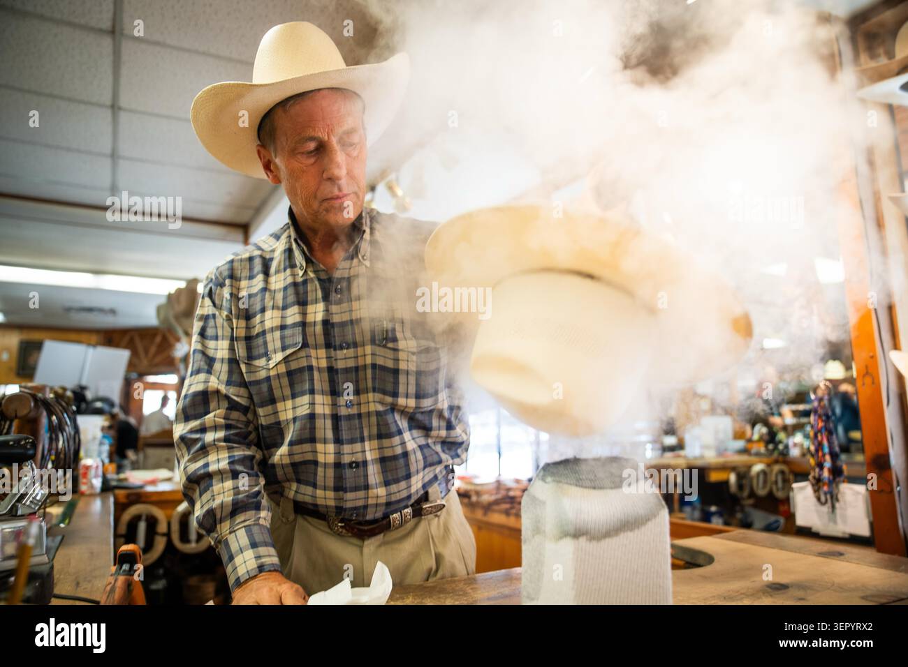 A man shapes a hat at M.L. Leddy's hat shop in the Fort Worth ...