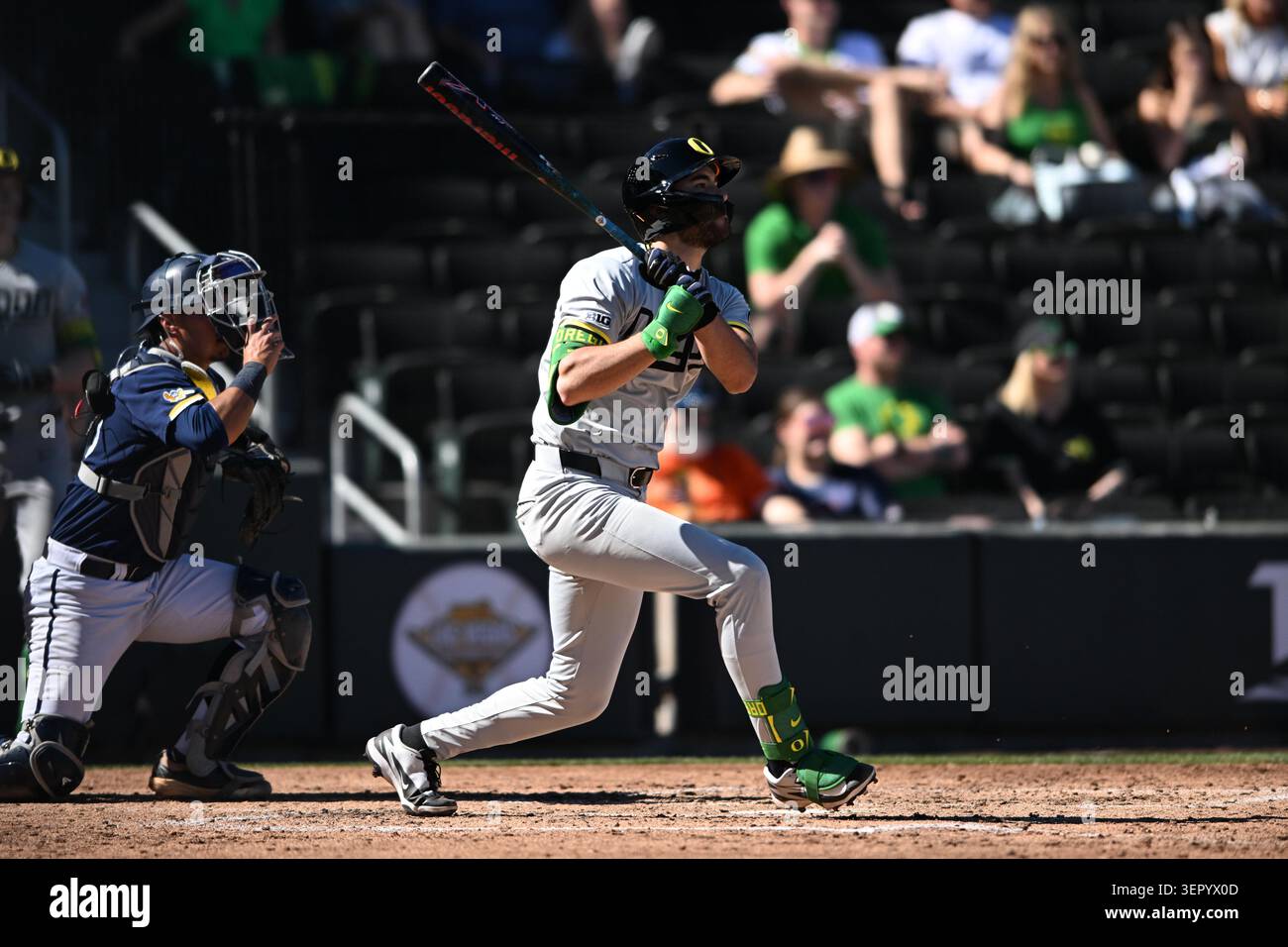 Angel Laya (53) of the Oregon Ducks follows through on a swing during a ...