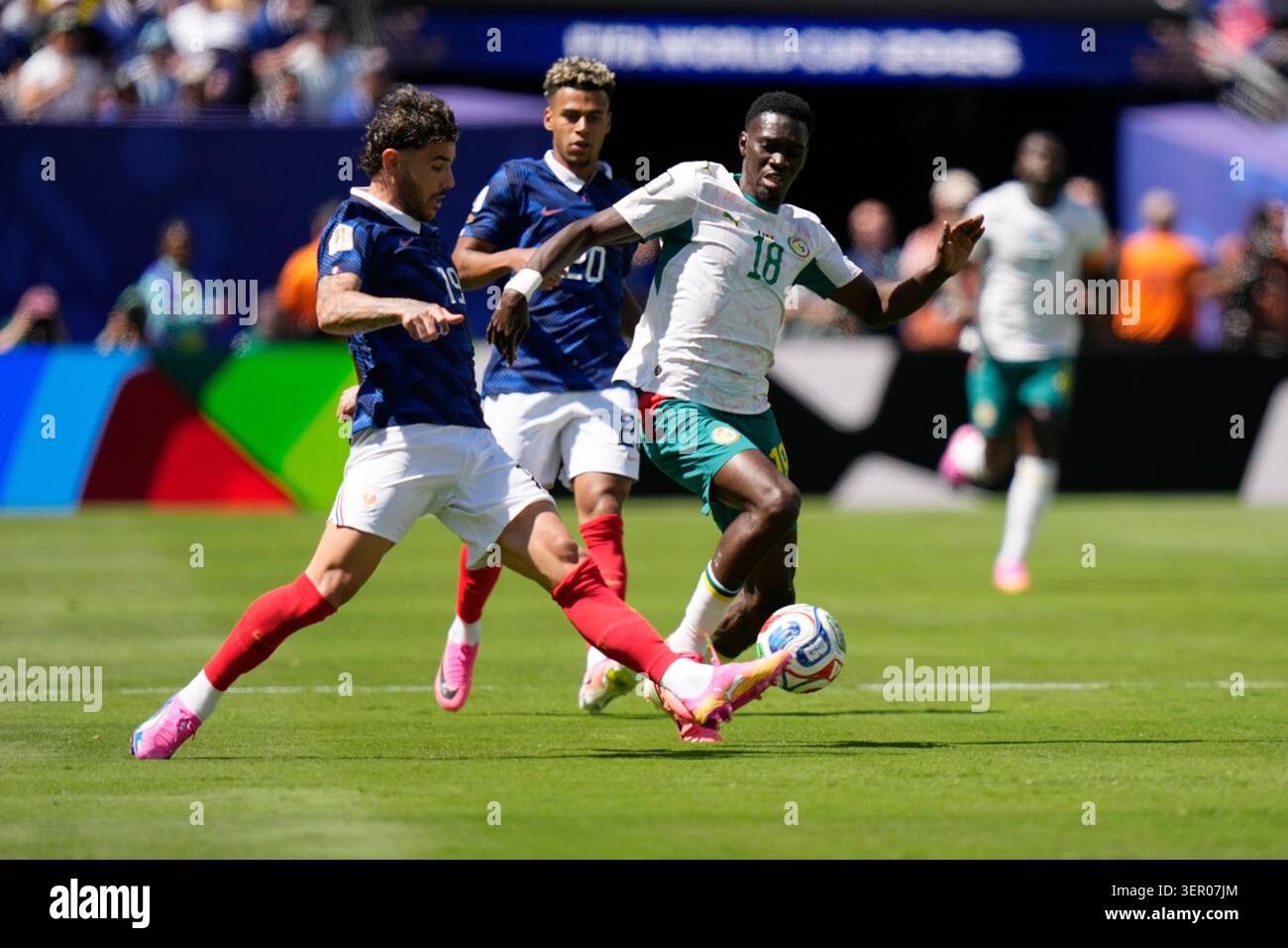 France's Theo Hernandez, left, and Senegal's Ismaila Sarr fight for the ...