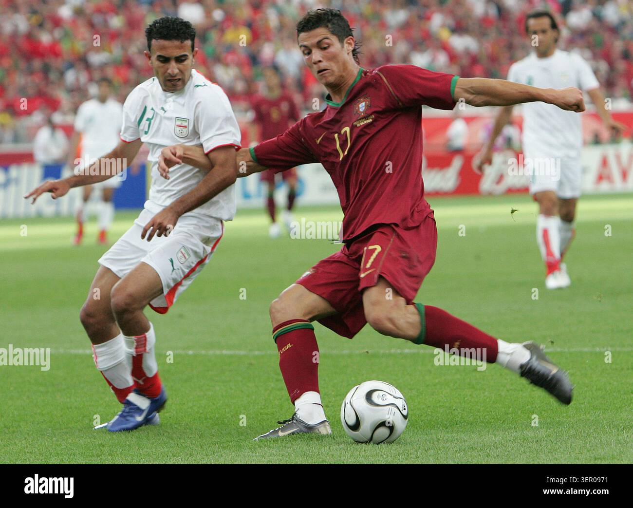 FILE - Portugal's Cristiano Ronaldo, right, and Iran's Hossein Kaabi ...