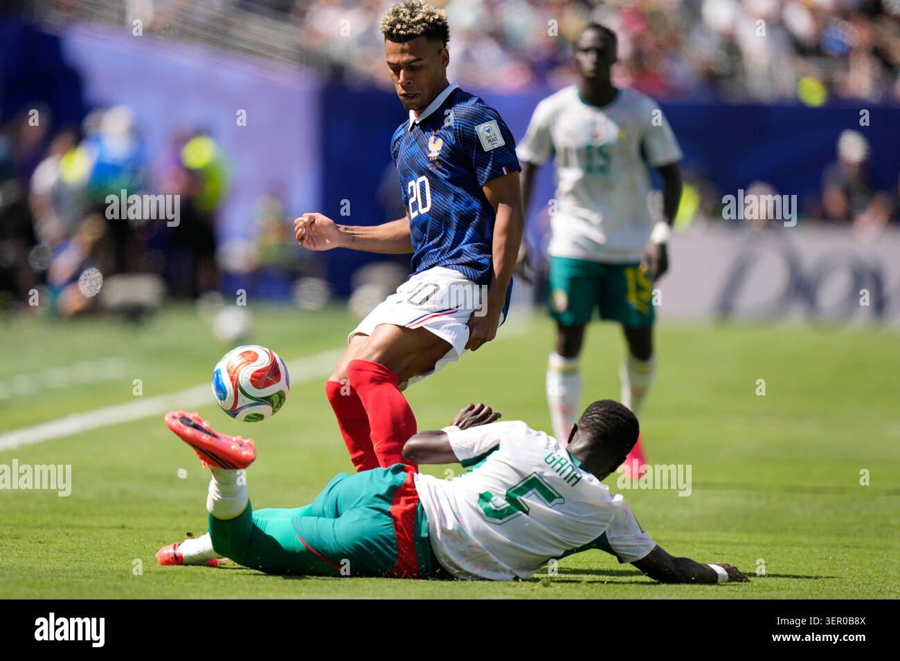 Senegal's Idrissa Gana Gueye (5) tris to stop France's Desire Doue (20 ...