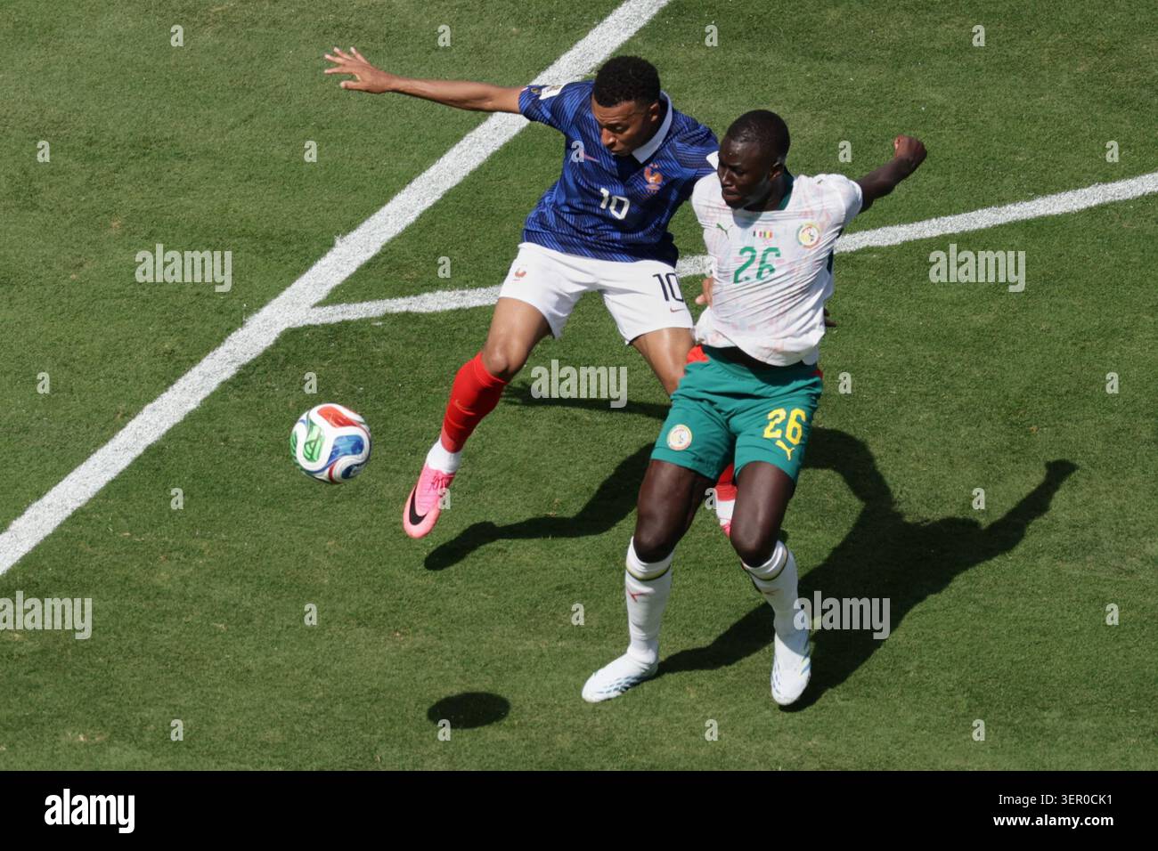 France's Kylian Mbappe, left, and Senegal's Pape Gueye fight for the ...