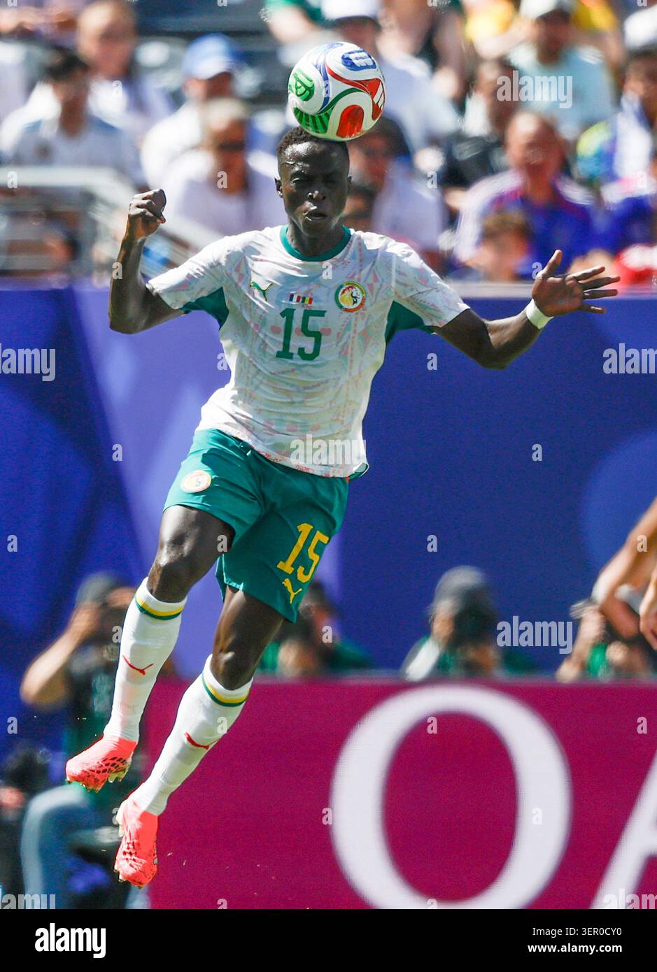 Senegal's Krepin Diatta heads the ball against France in the first half ...