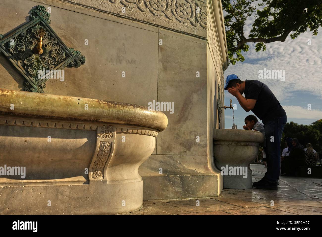 People cool off in a public fountain in Istanbul, Turkey, Tuesday, June ...