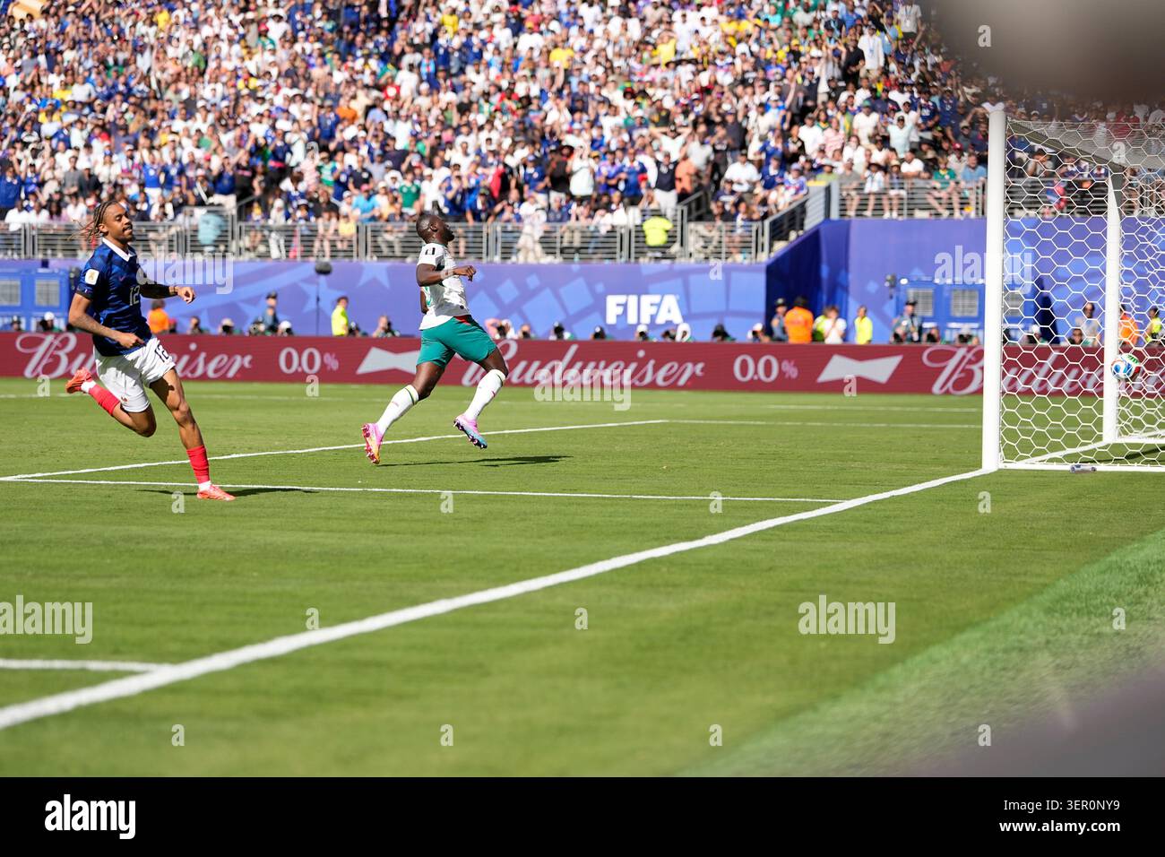 France's Bradley Barcola, left, scores his side's second goal during ...