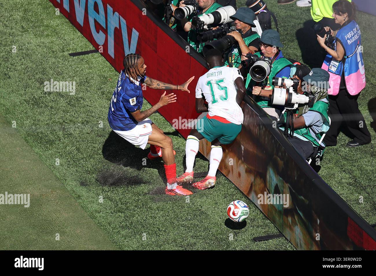 Senegal's Krepin Diatta (15) crashes into the boards with France's ...