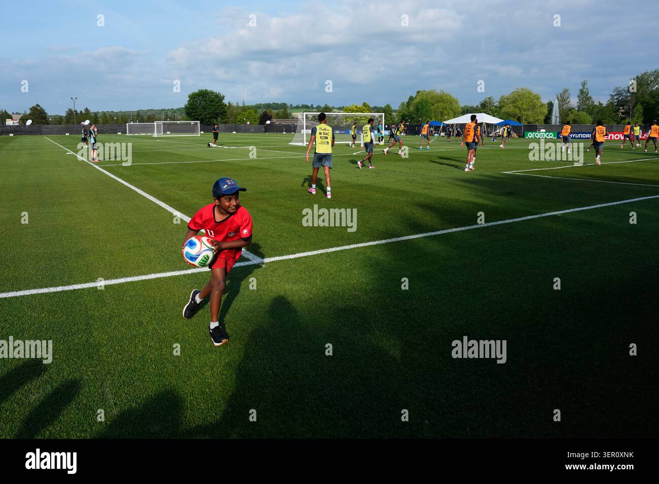 A young boy retrieves a ball as fans watch Panama train at their World ...