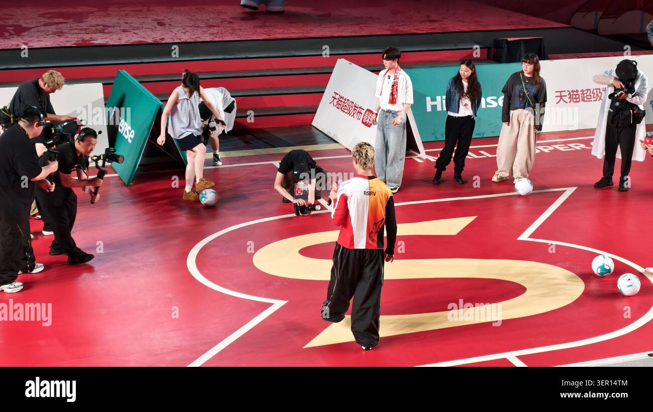 Singer Mika Hashizume teaches fans how to play soccer at Tmall World ...