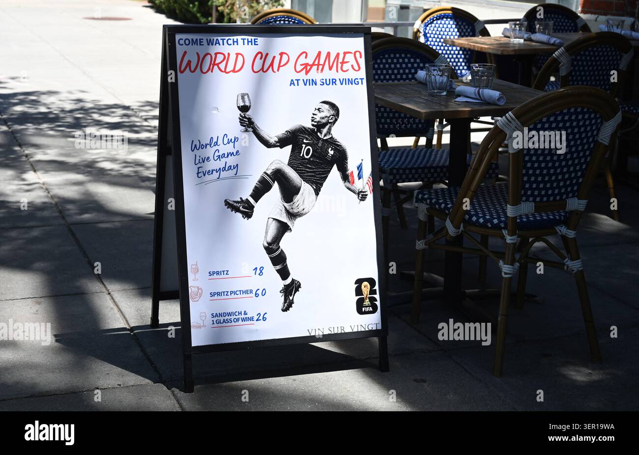 A restaurant displays a poster with French player Kylian Mbappé for ...