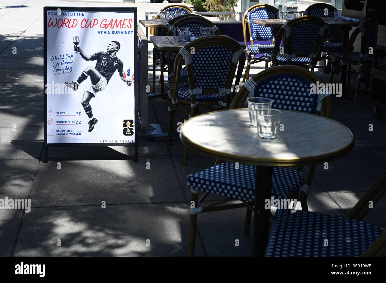 A restaurant displays a poster with French player Kylian Mbappé for ...