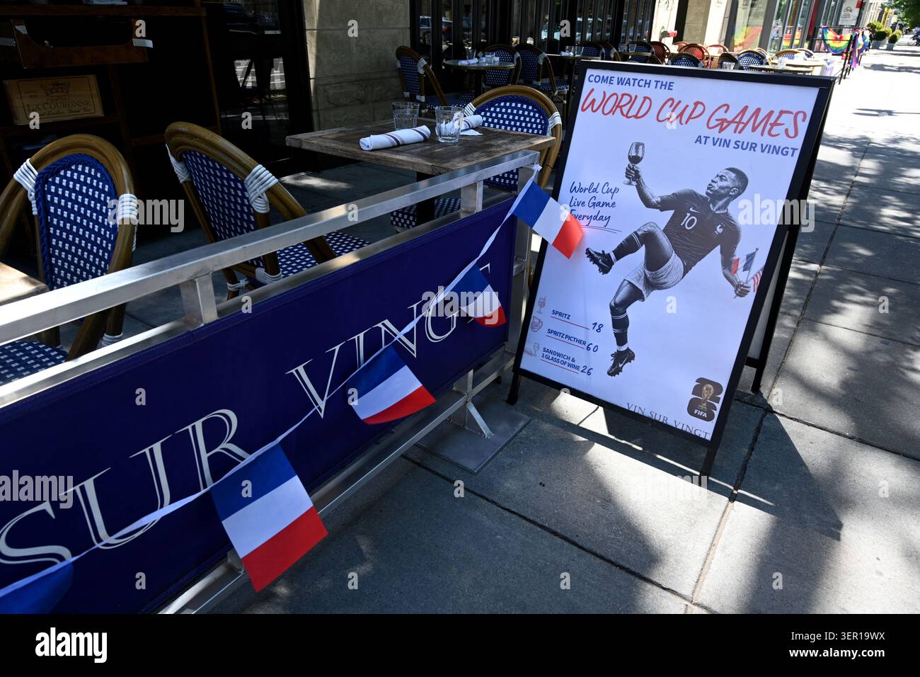 A restaurant displays a poster with French player Kylian Mbappé for ...