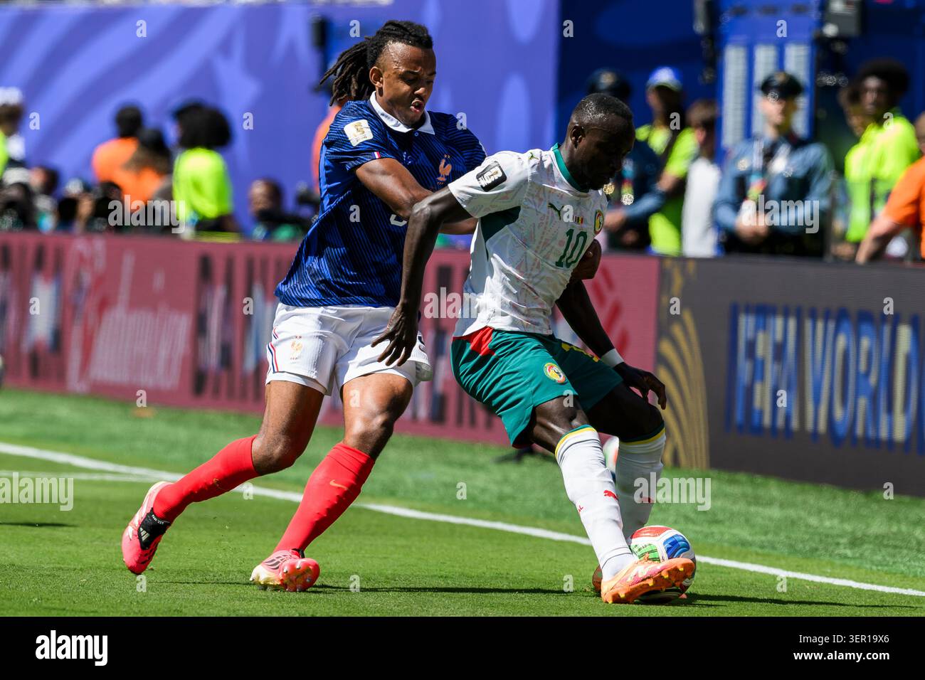 Sadio Mane of Senegal competes for the ball with Jules Kounde of France ...