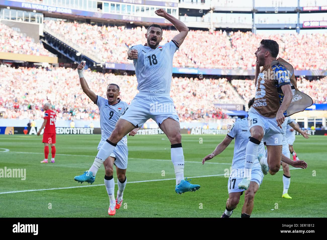 Iraq's Aymen Hussein (18), celebrates scoring his side's first goal ...