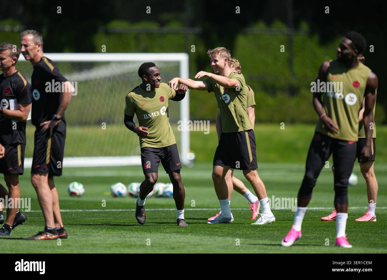 Canada's Luc de Fougerolles, centre right, playfully shoves Richie ...
