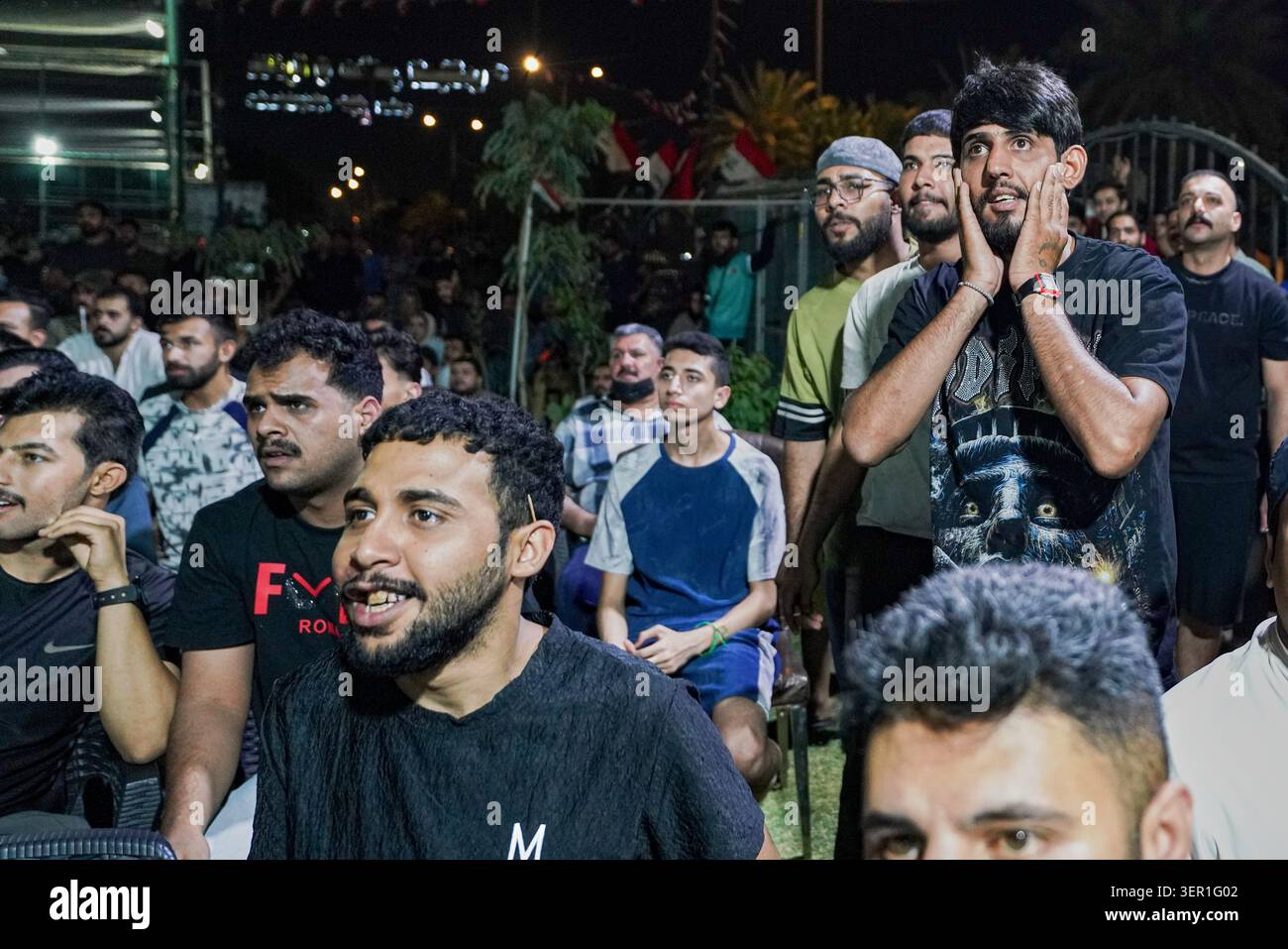 Iraqi soccer fans watch the World Cup match between Iraq and Norway on ...