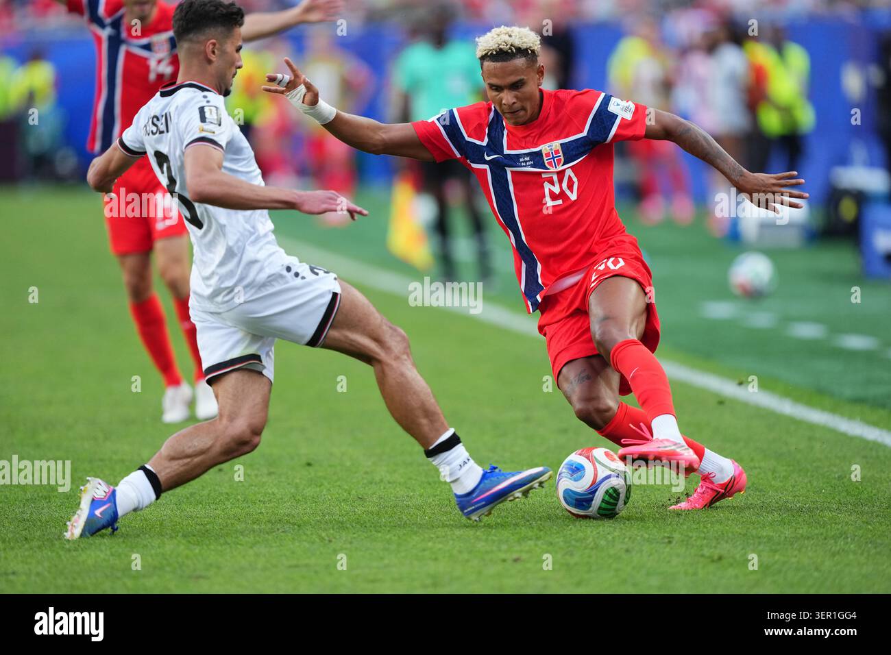 Norway's Antonio Nusa, right, and Iraq's Hussein Ali compete for the ...