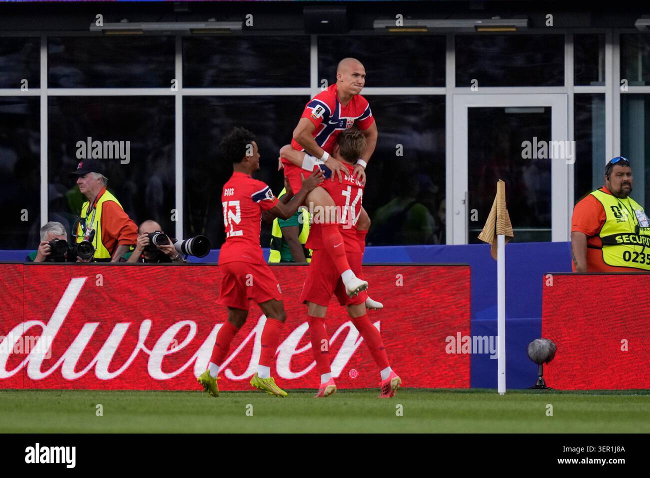 Norway's Leo Oestigard (4), center, celebrates with teammates after ...