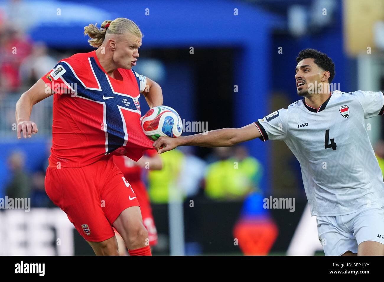 Iraq's Zaid Tahseen, right, grabs Norway's Erling Haaland during the ...