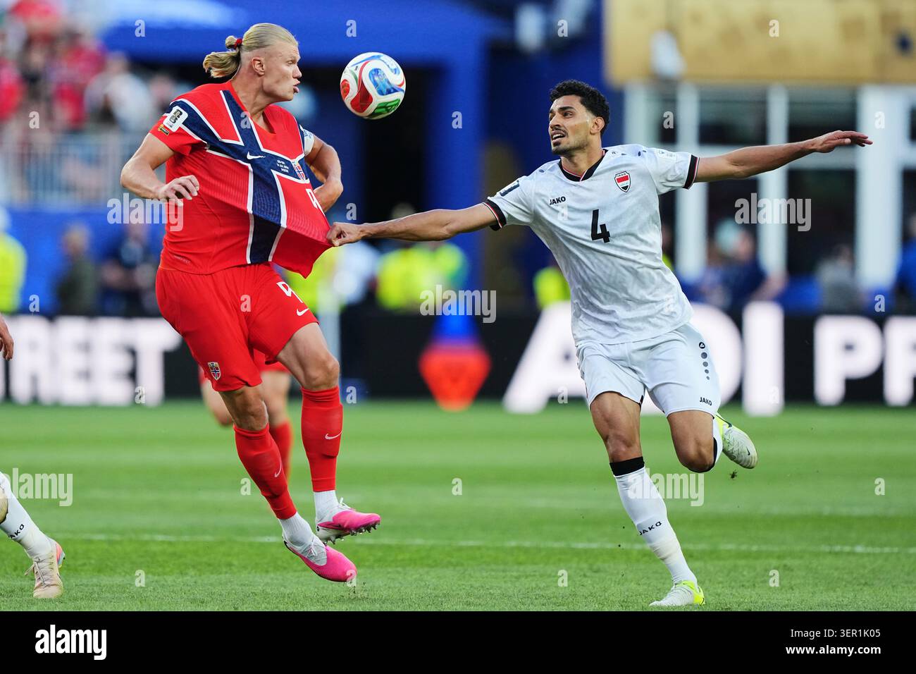 Iraq's Zaid Tahseen, right, grabs Norway's Erling Haaland during the ...