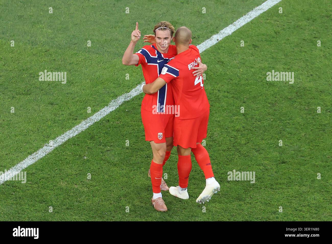 Norway's Kristian Thorstvedt (18) celebrates a win with Leo Oestigard ...