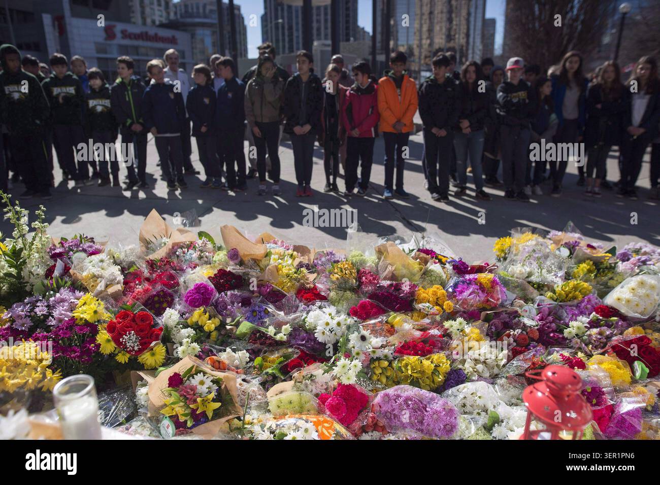 Flowers line a memorial at Mel Lastman Square in Toronto on Thursday ...
