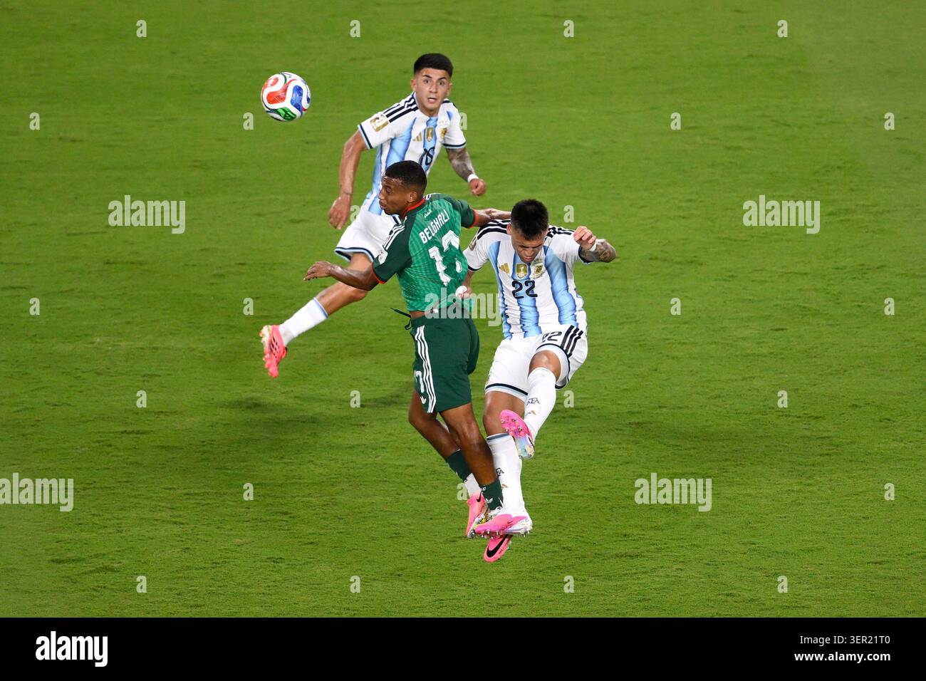 Algeria's Rafik Belghali (17) challenges for the ball with Argentina's ...