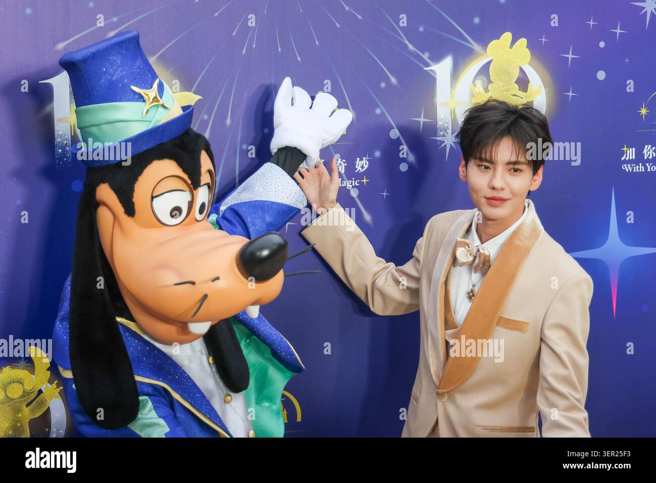 Chinese actor Bi Wenjun poses with Goofy during the 10th anniversary ...