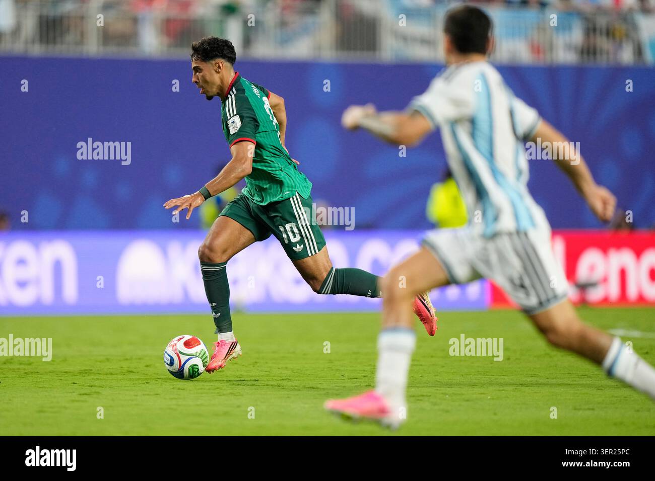 Algeria's Fares Chaibi runs with the ball during the World Cup Group J ...