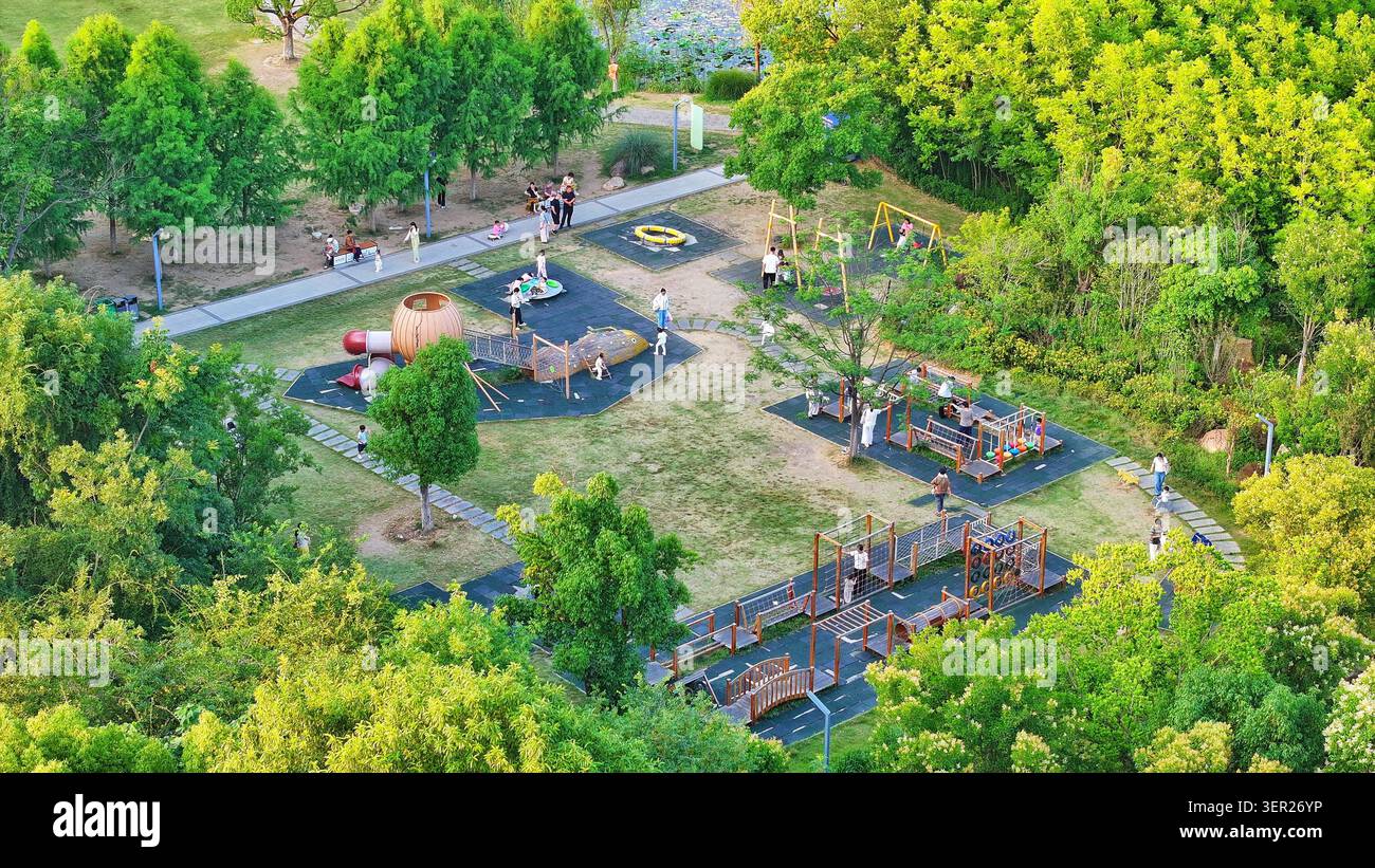 Luzhou Park's Shushan District section shows lush greenery against blue ...