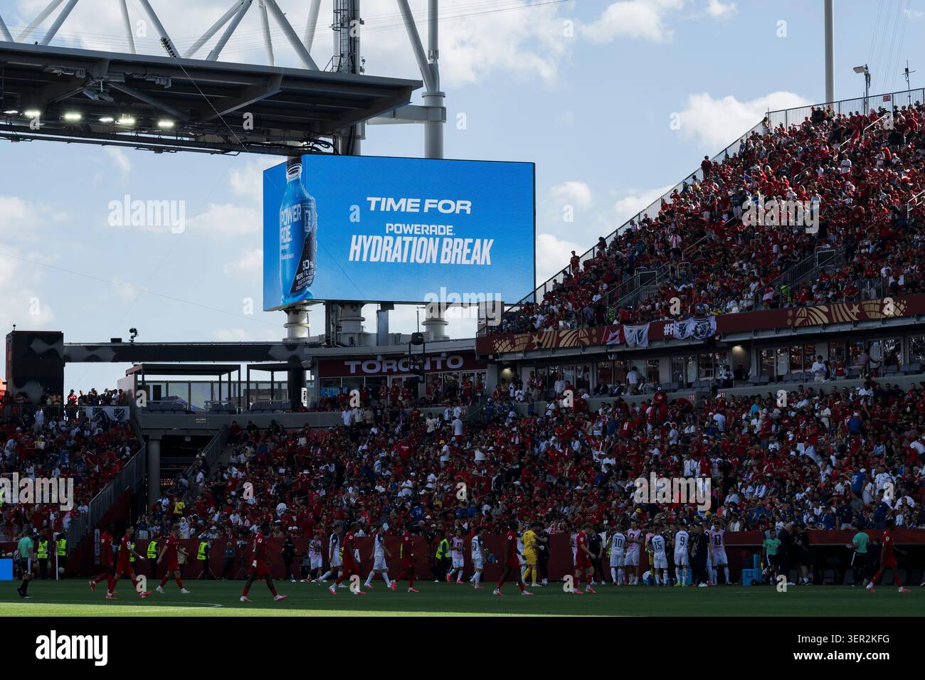 A giant screen shows teh write 'Time for powerade hydration break ...