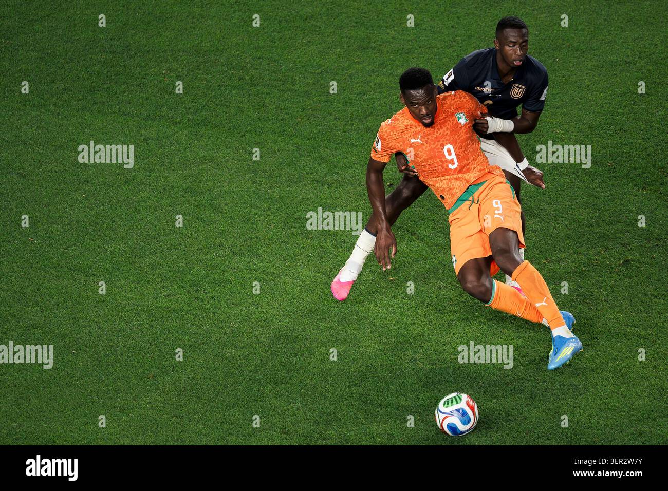 Ange-Yoan Bonny of Cote d'Ivoire competes for the ball with Willian ...